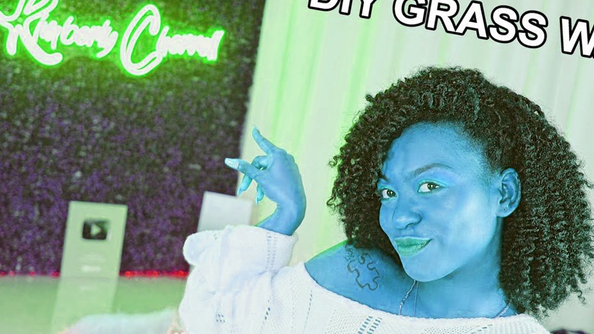 Grass wall with neon sign